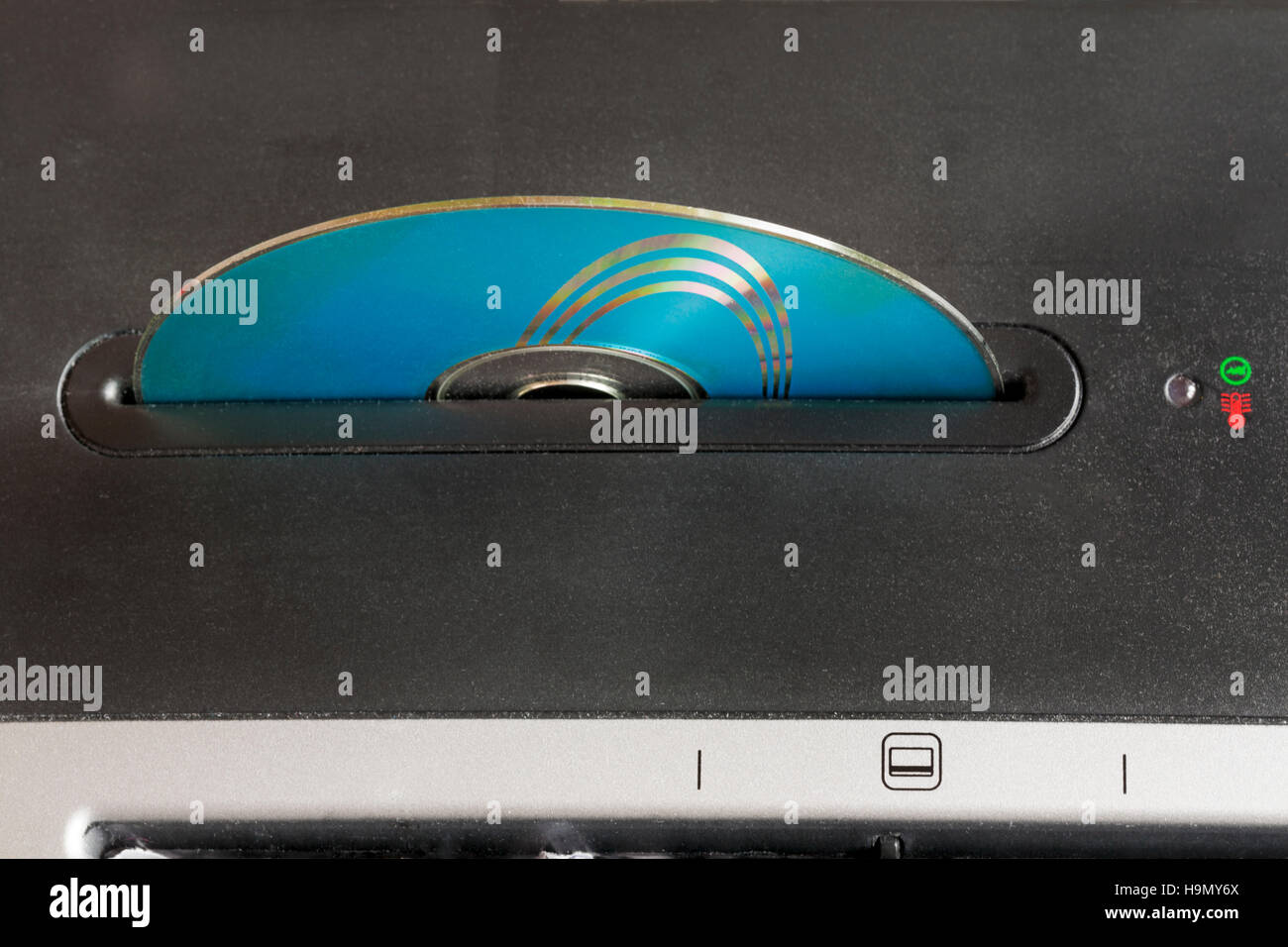 Compact disc inserted in shredder to destroy sensitive information ...