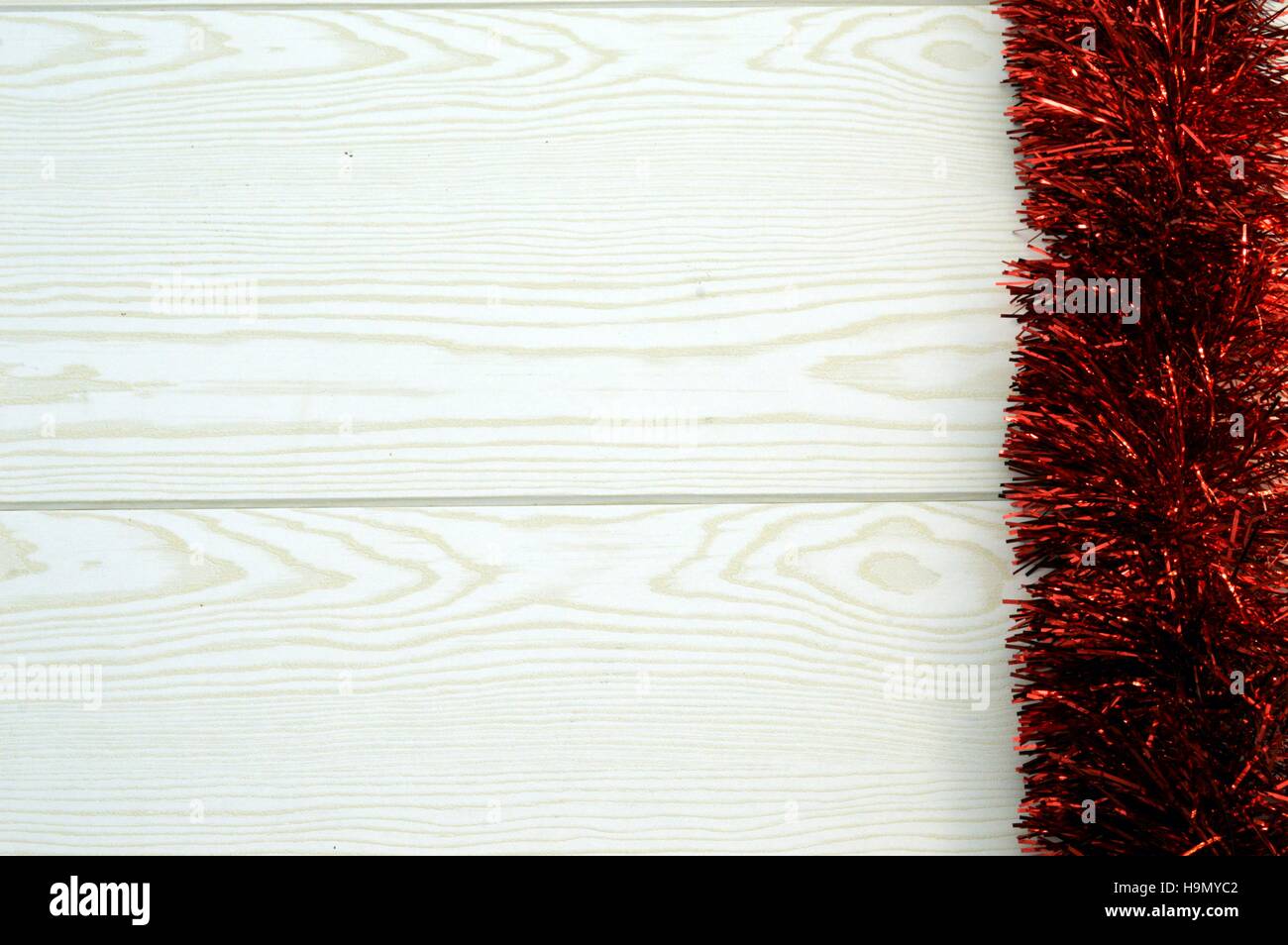 Vertical red garland on wooden background Stock Photo - Alamy