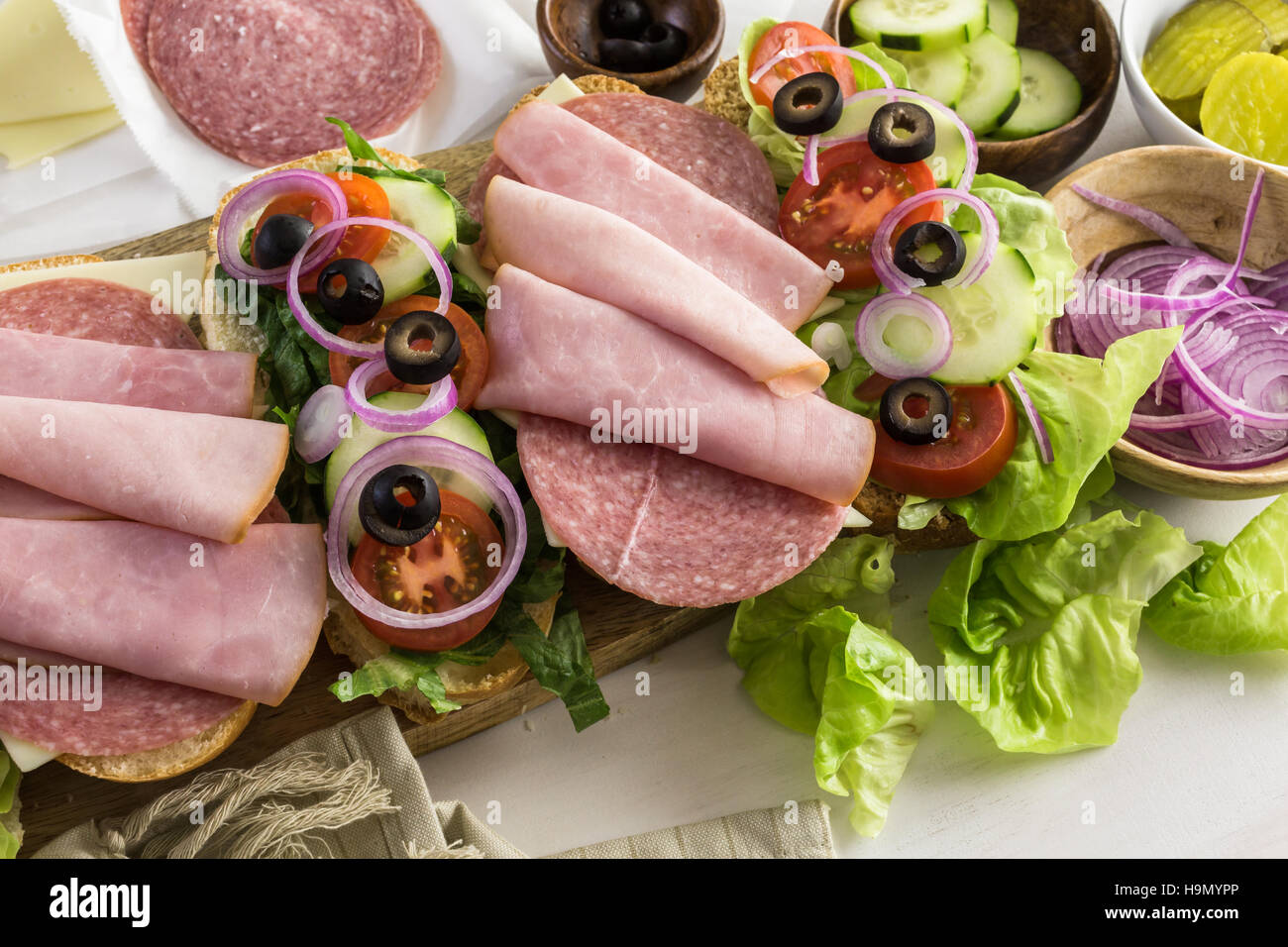 Fresh sub sandwich on white and wheat hoagies Stock Photo - Alamy