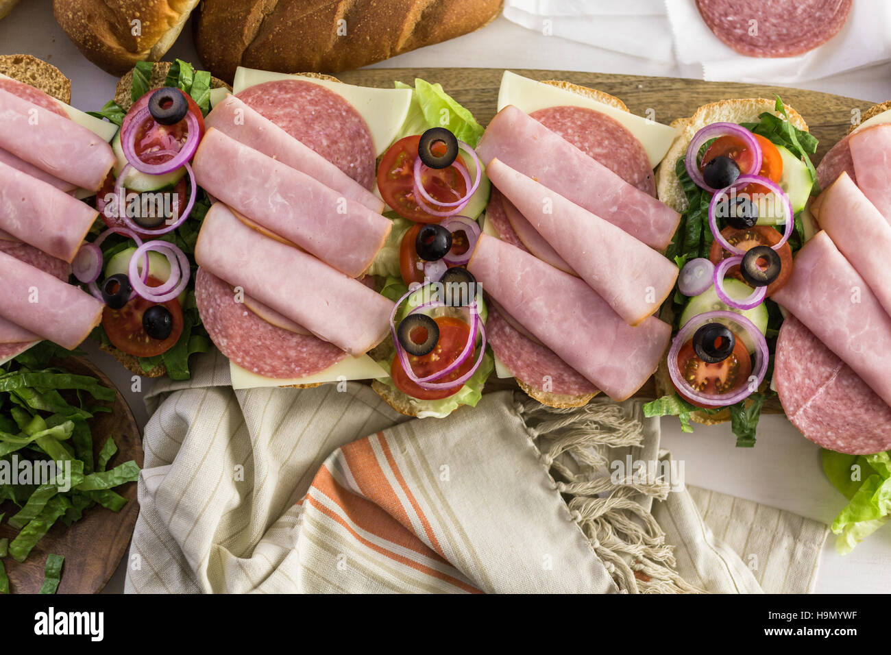 Fresh sub sandwich on white and wheat hoagies Stock Photo - Alamy