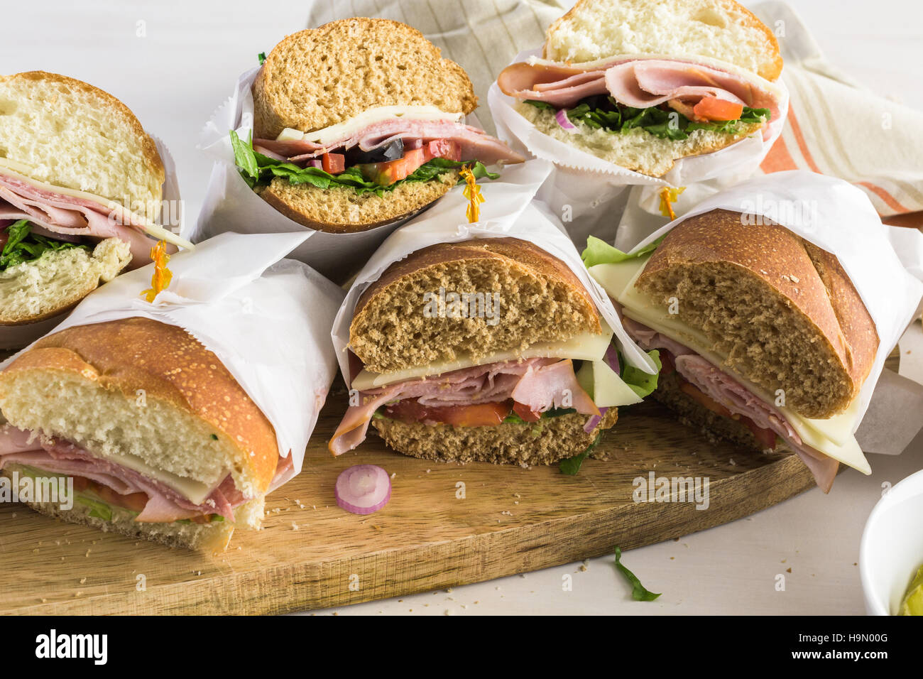 Fresh sub sandwich on white and wheat hoagies Stock Photo - Alamy