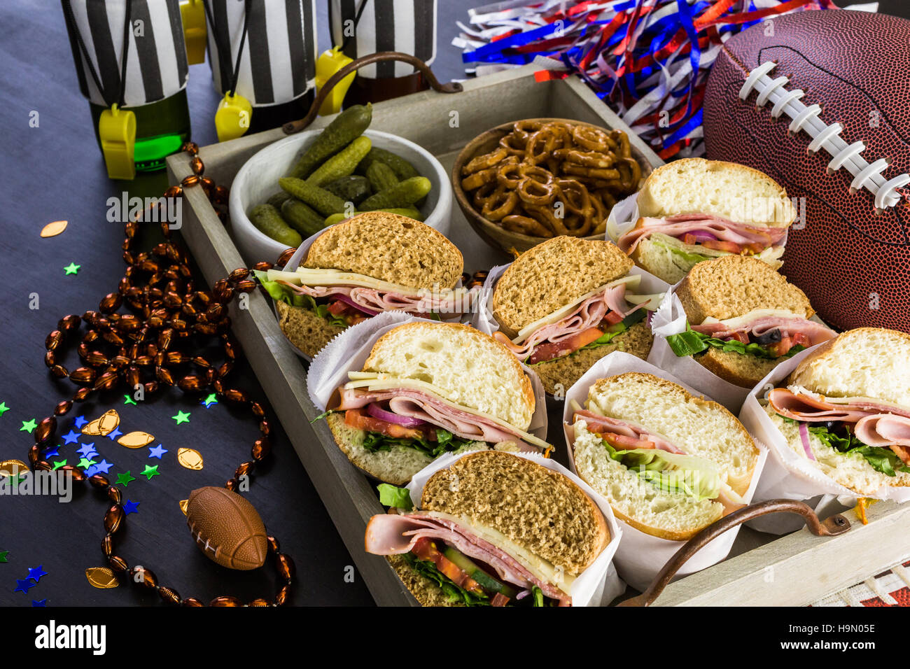 Game day football party table with sub sandwich and snacks Stock Photo ...