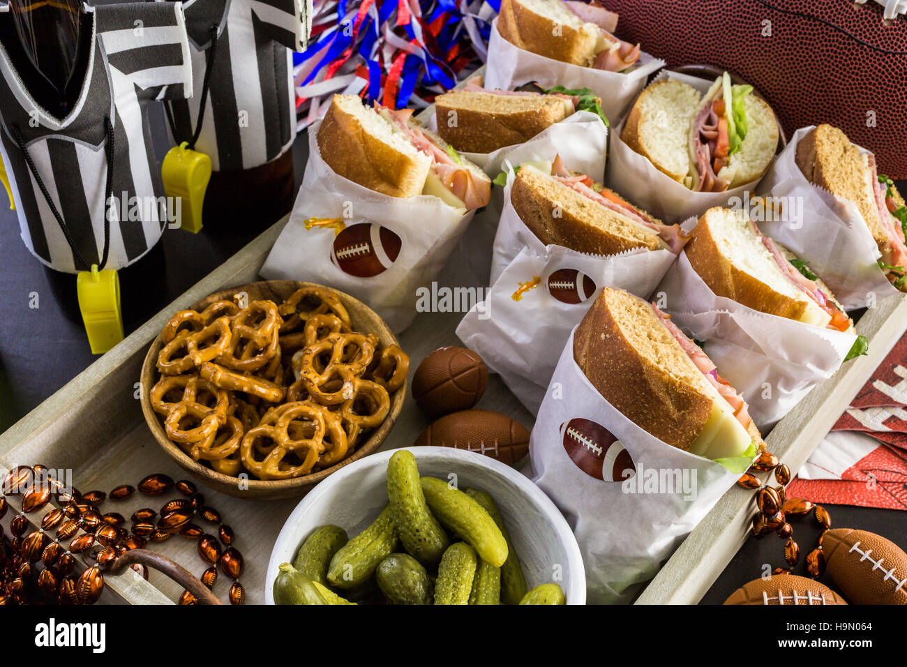 Game day football party table with sub sandwich and snacks Stock Photo ...