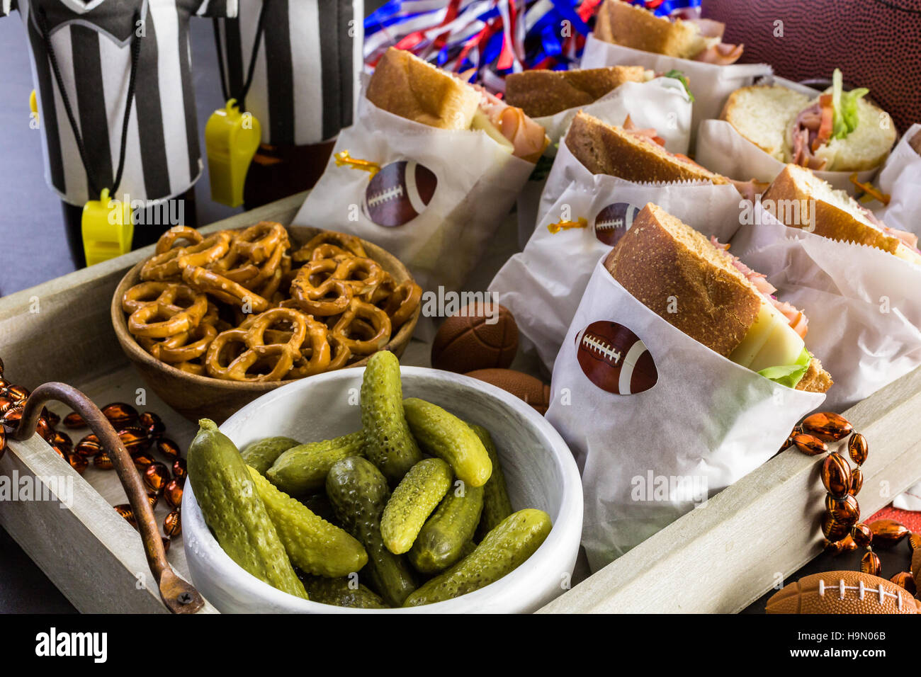 Game day football party table with sub sandwich and snacks Stock Photo ...