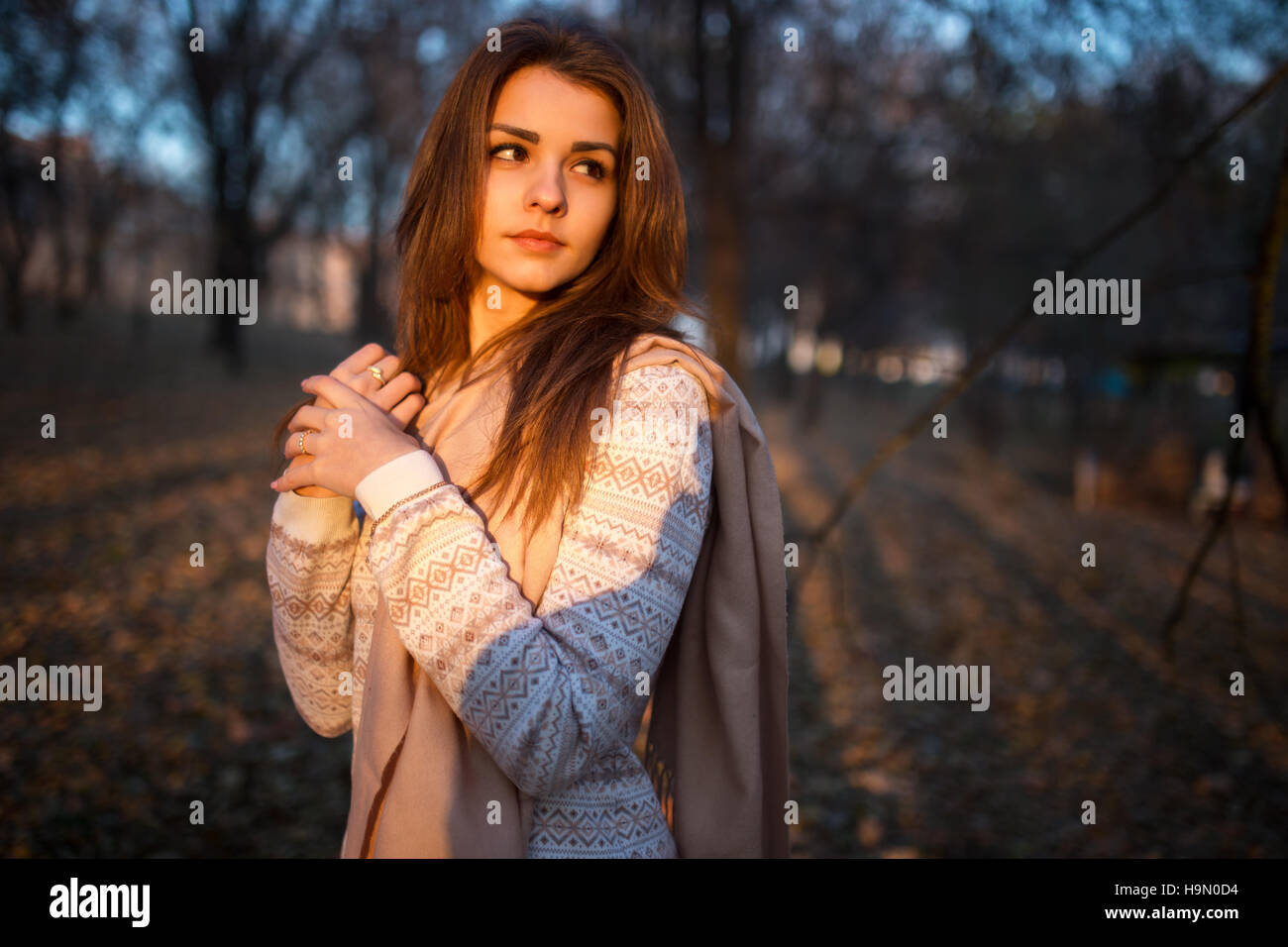 Sunset portrait of beautiful brunette young woman in autumn park Stock ...