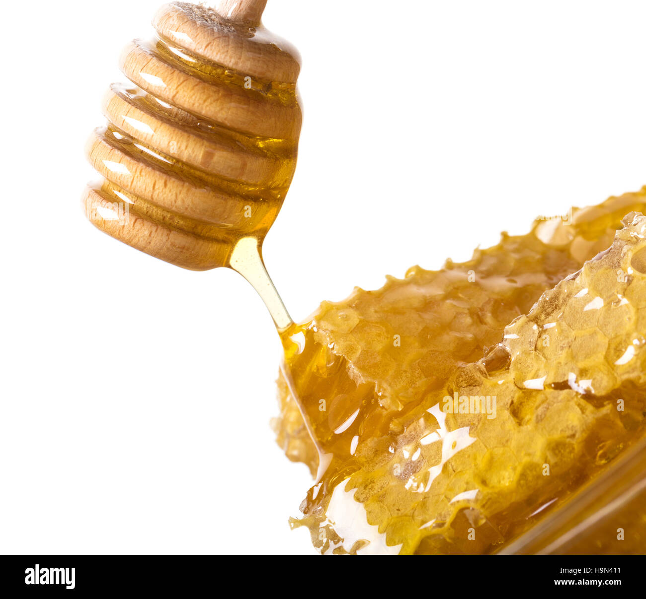 Golden yellow fresh honey flowing hi-res stock photography and images ...