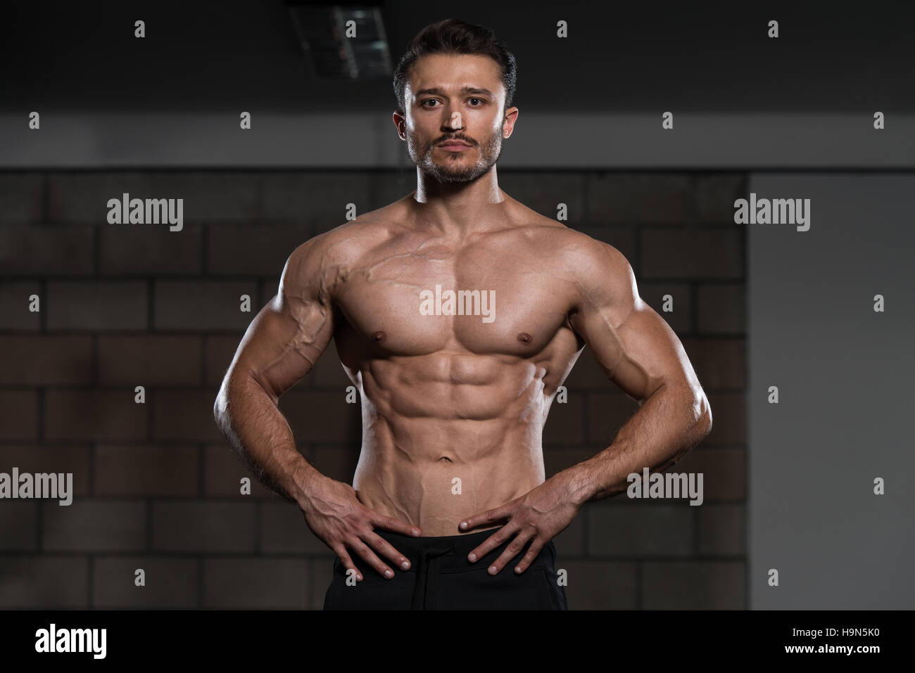 Portrait Of A Young Physically Fit Man Showing His Well Trained Body ...