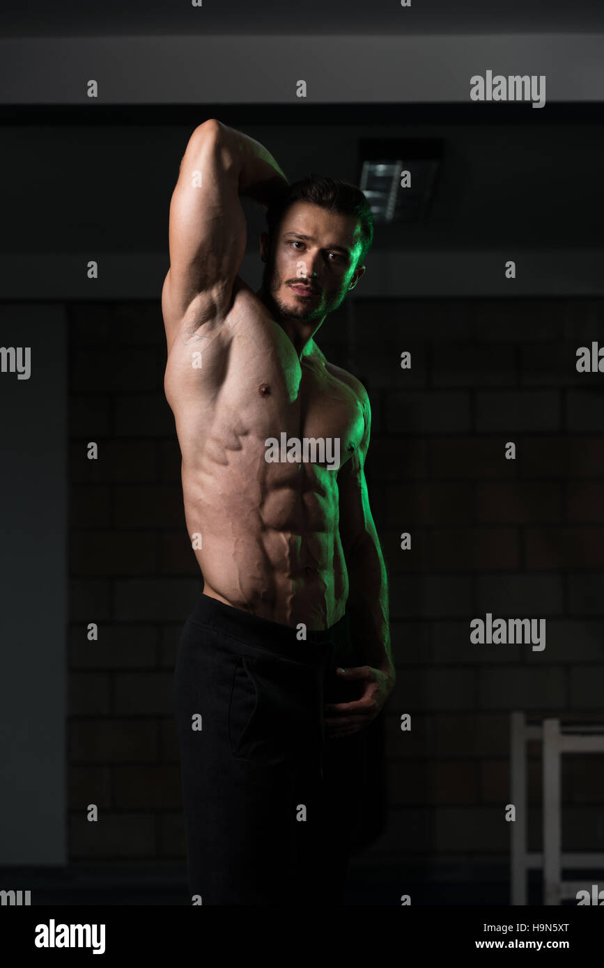 Portrait Of A Young Physically Fit Man Showing His Well Trained Body ...