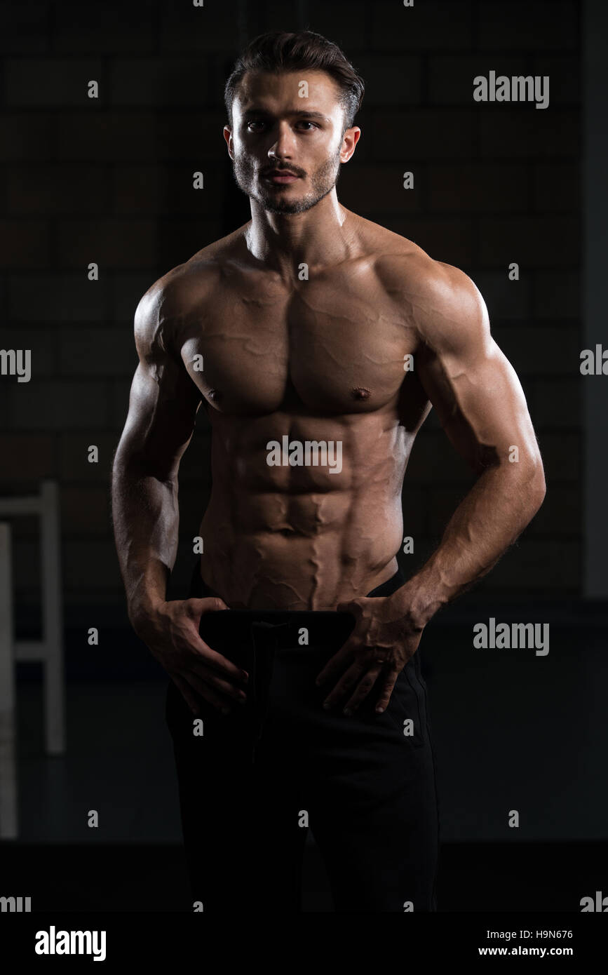 Portrait Of A Young Physically Fit Man Showing His Well Trained Body ...