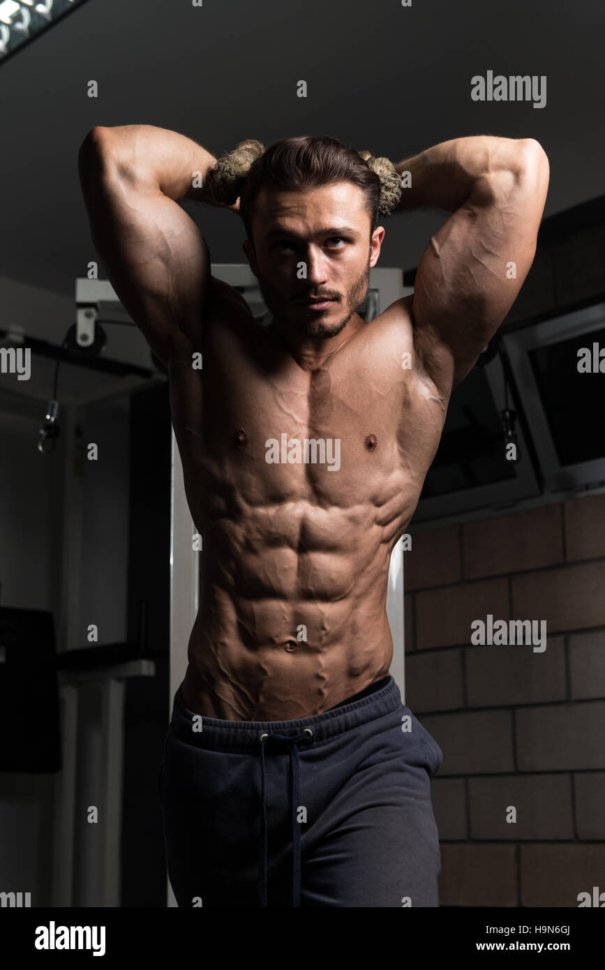 Handsome Muscular Fitness Bodybuilder Doing Heavy Weight Exercise For ...