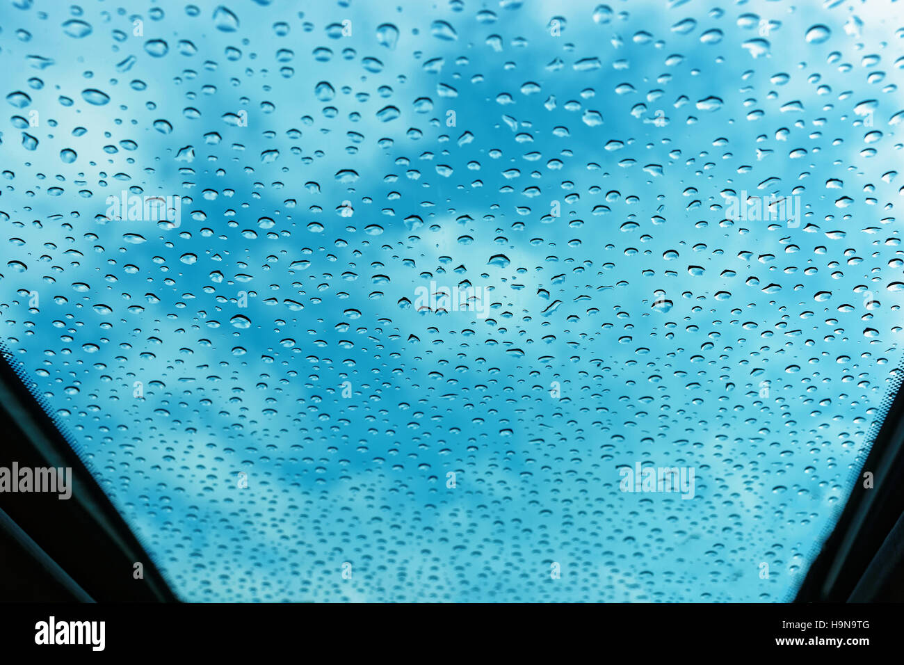 Rain drops on window glass of a car Stock Photo - Alamy