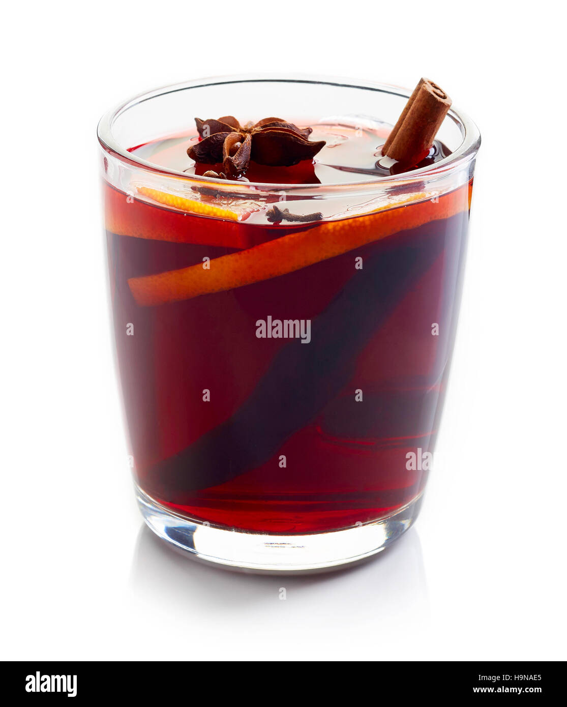Hot red mulled wine with orange slice and christmas spices isolated on ...