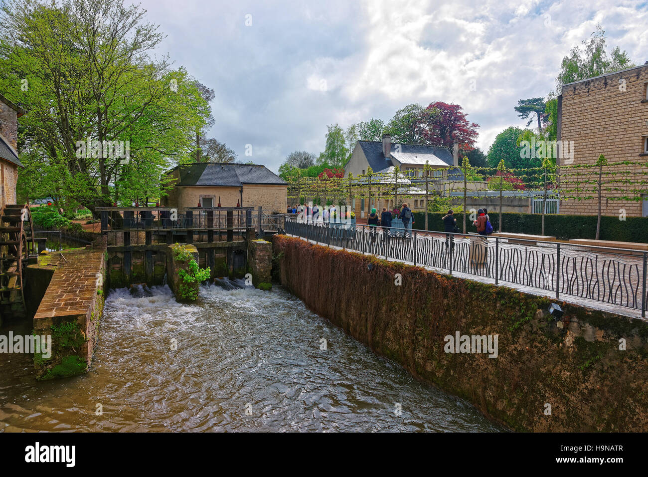 Water mill and Aure River in the old city of Bayeux in Calvados ...
