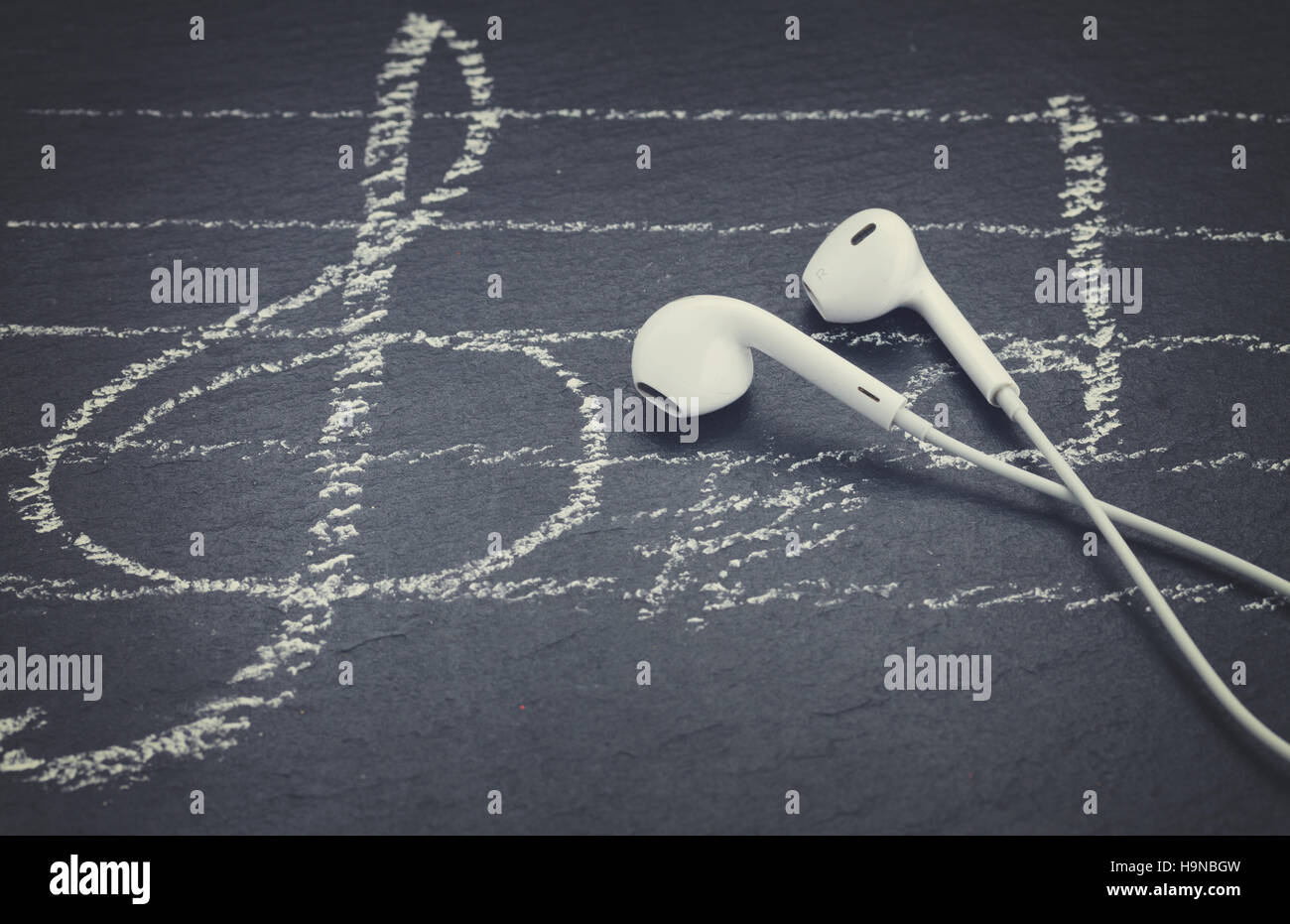 Music notes with headphones Stock Photo - Alamy