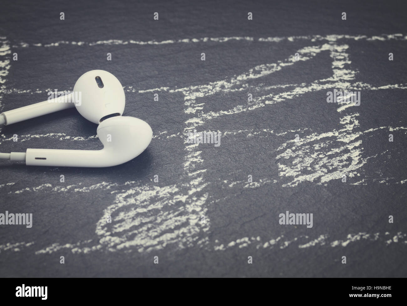 Music notes with headphones Stock Photo - Alamy
