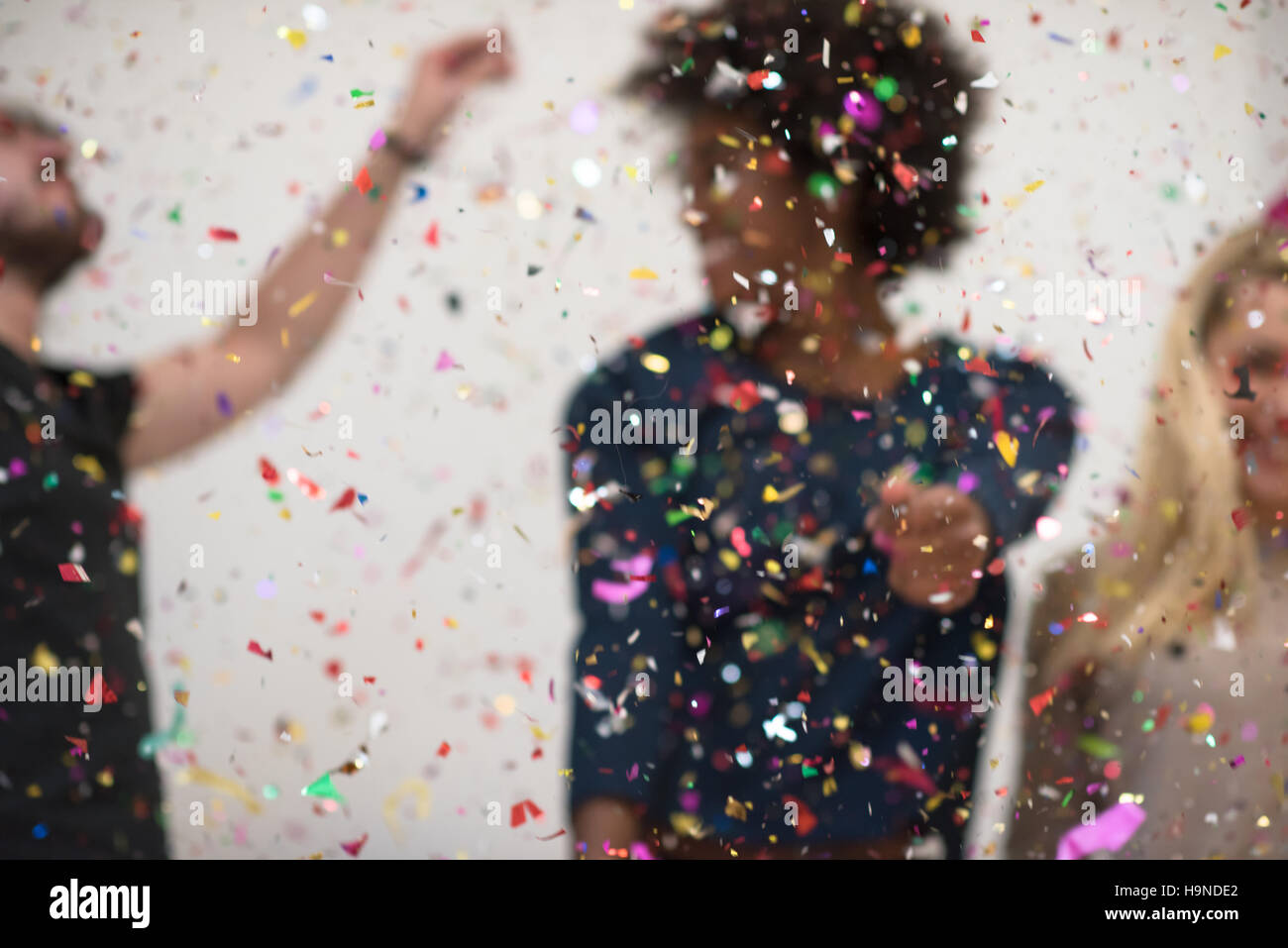 confetti party happy young people group celebrating new year eve while ...