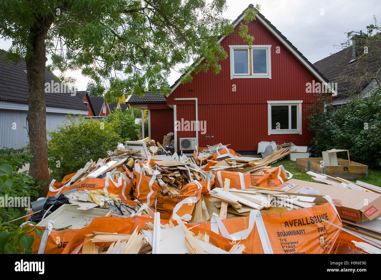 Construction materials and debris outside a house being renovated Stock ...