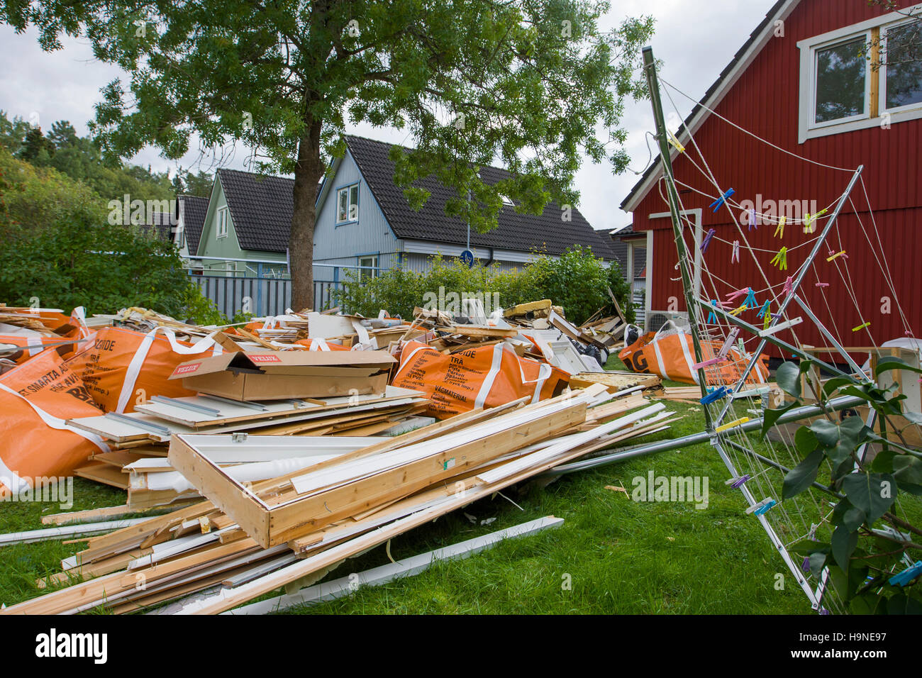 Construction materials and debris outside a house being renovated Stock ...