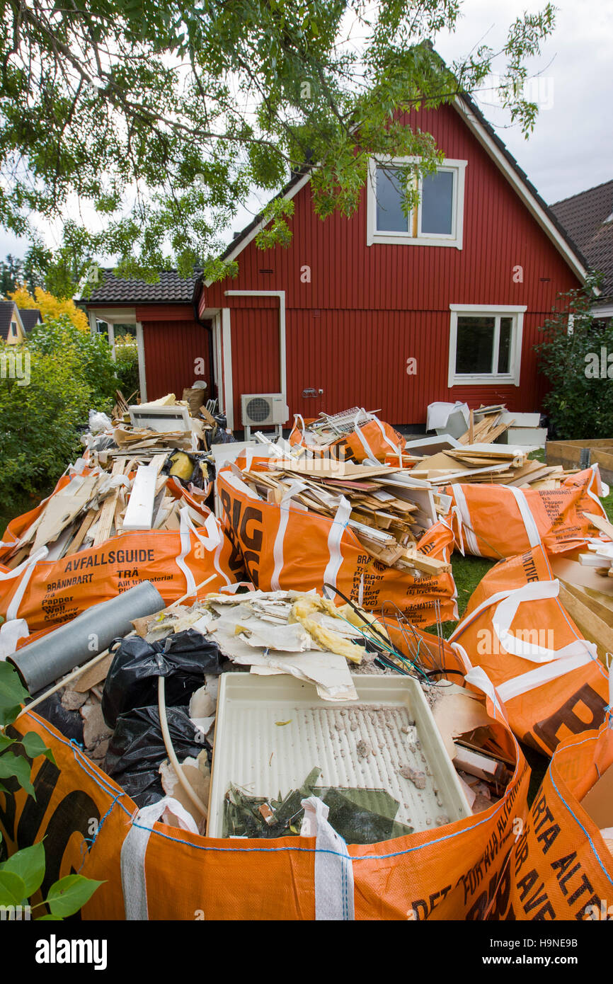 Construction materials and debris outside a house being renovated Stock ...