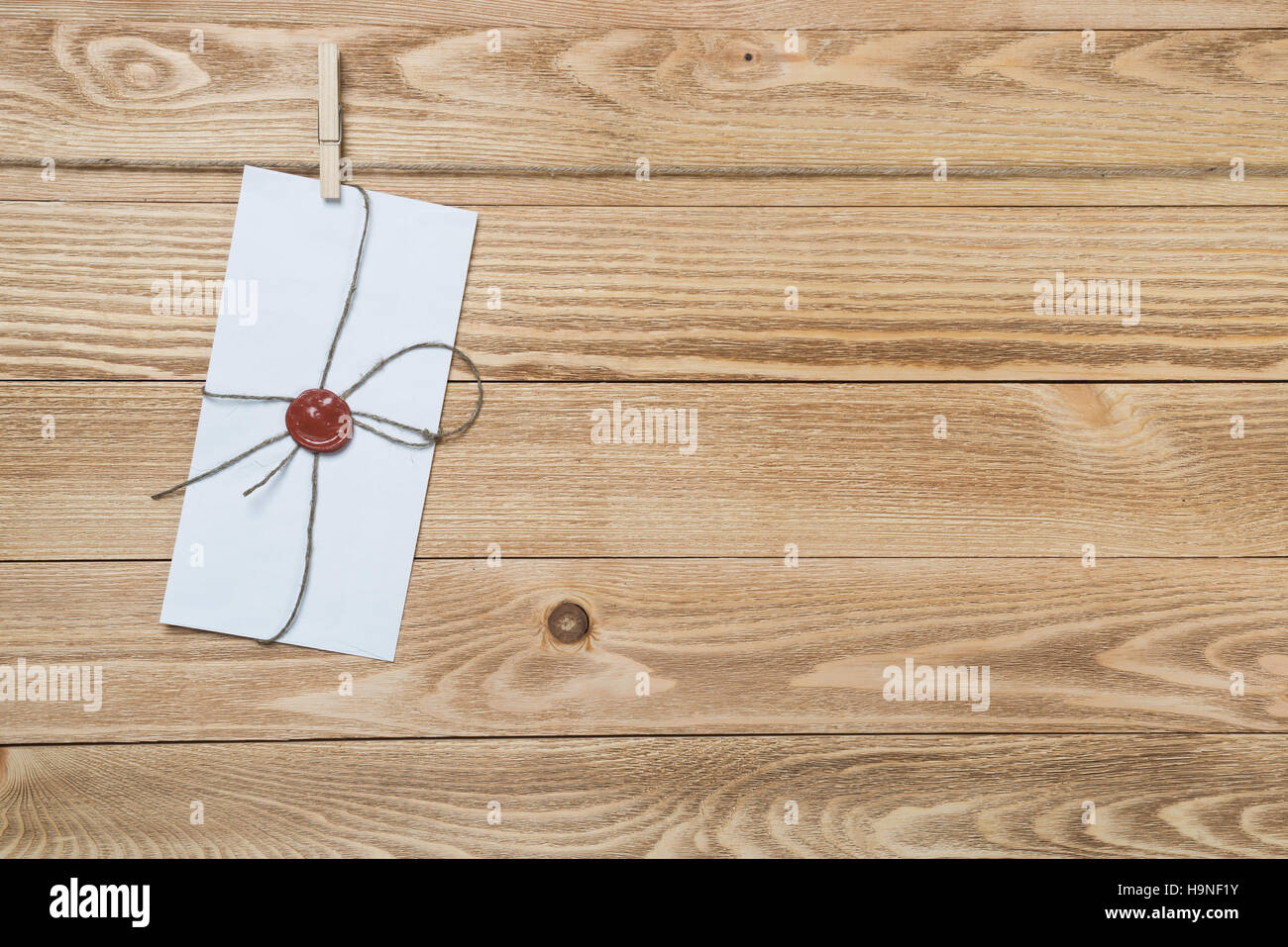 Mail envelope on rope Stock Photo - Alamy