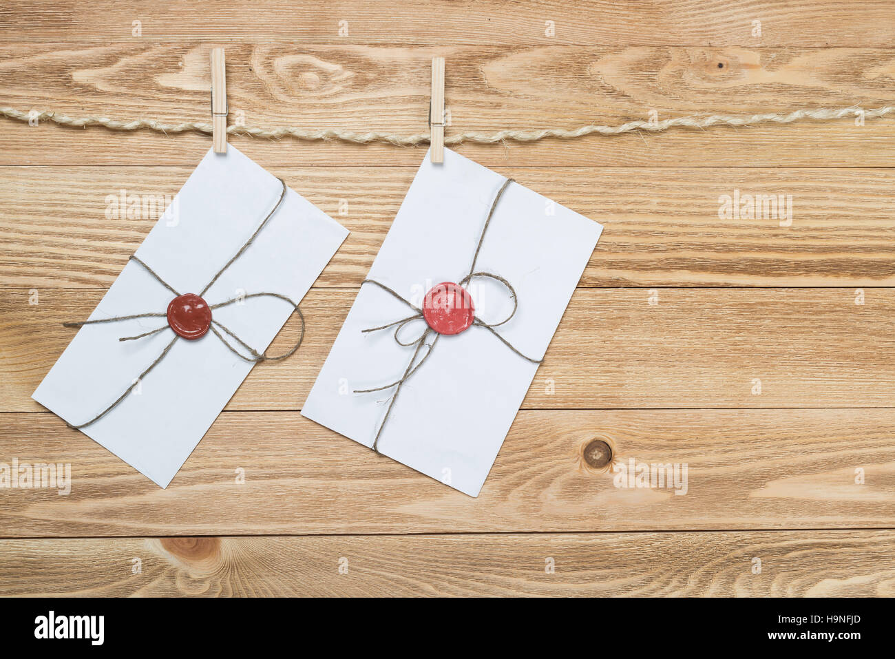 Mail envelope on rope Stock Photo - Alamy