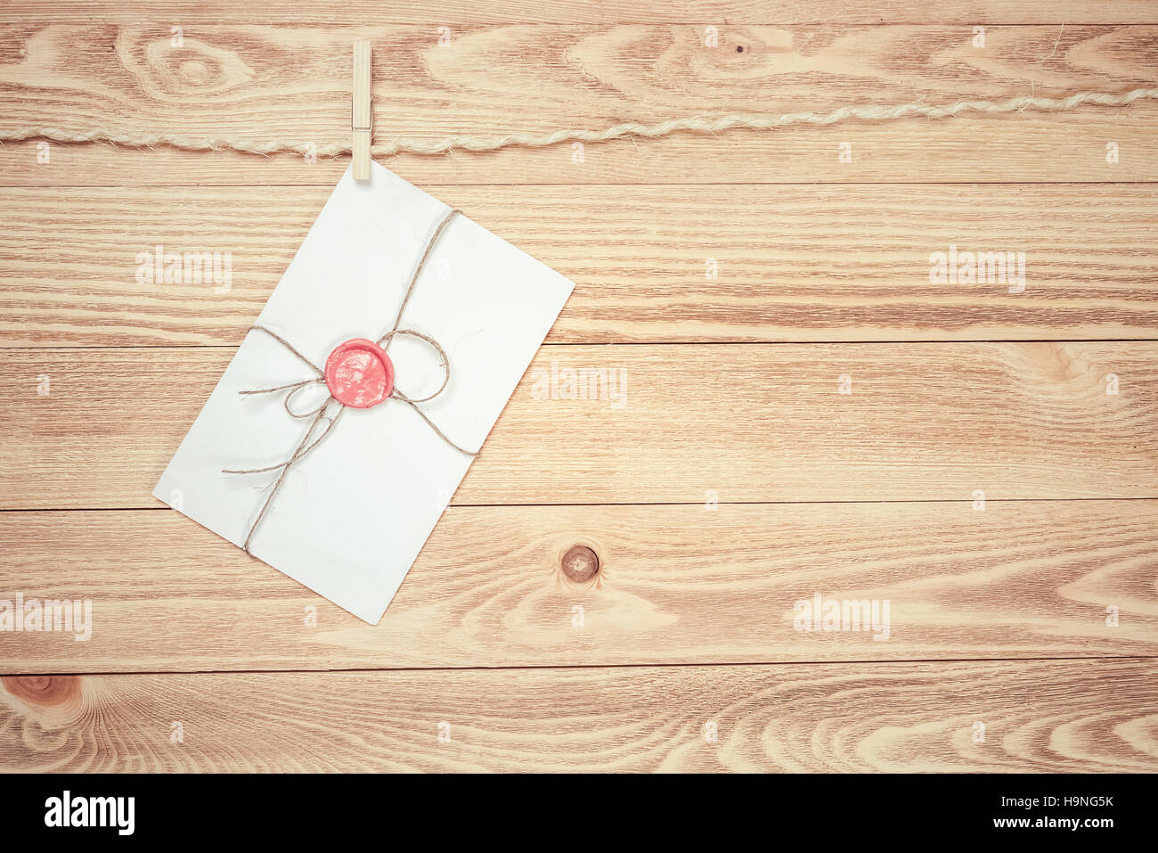 Mail envelope on rope Stock Photo - Alamy