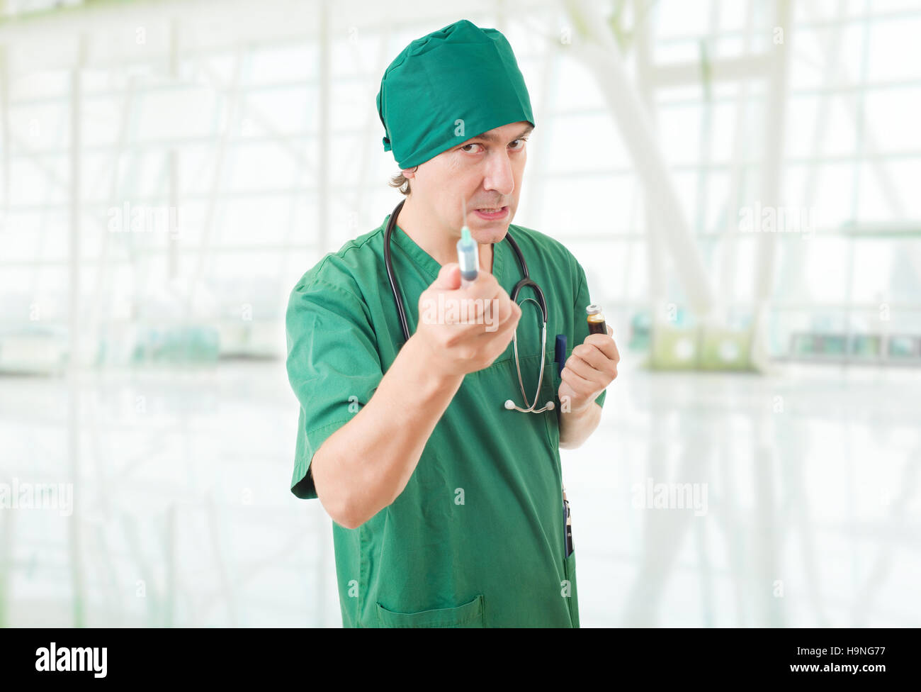 mad doctor with a syringe at the hospital Stock Photo - Alamy