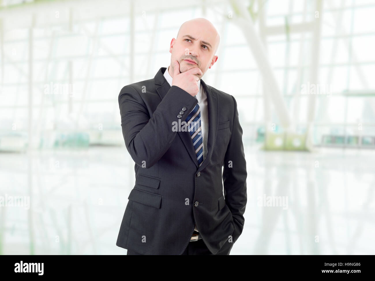 young business man thinking, at the office Stock Photo - Alamy