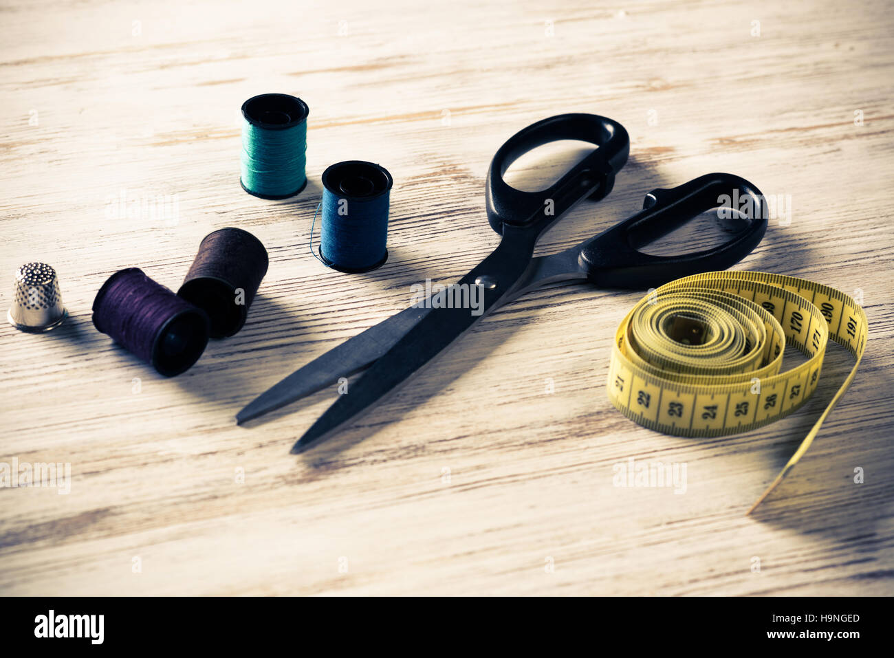 Sewing kit on table Stock Photo - Alamy