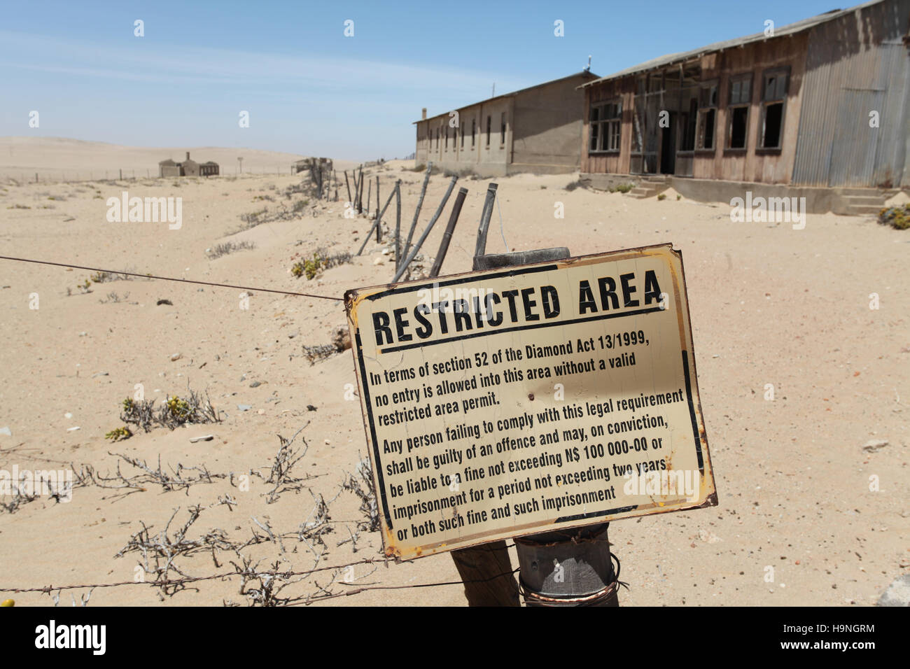 Restricted area sign at the Sperrgebiet diamond mine in Namibia where ...