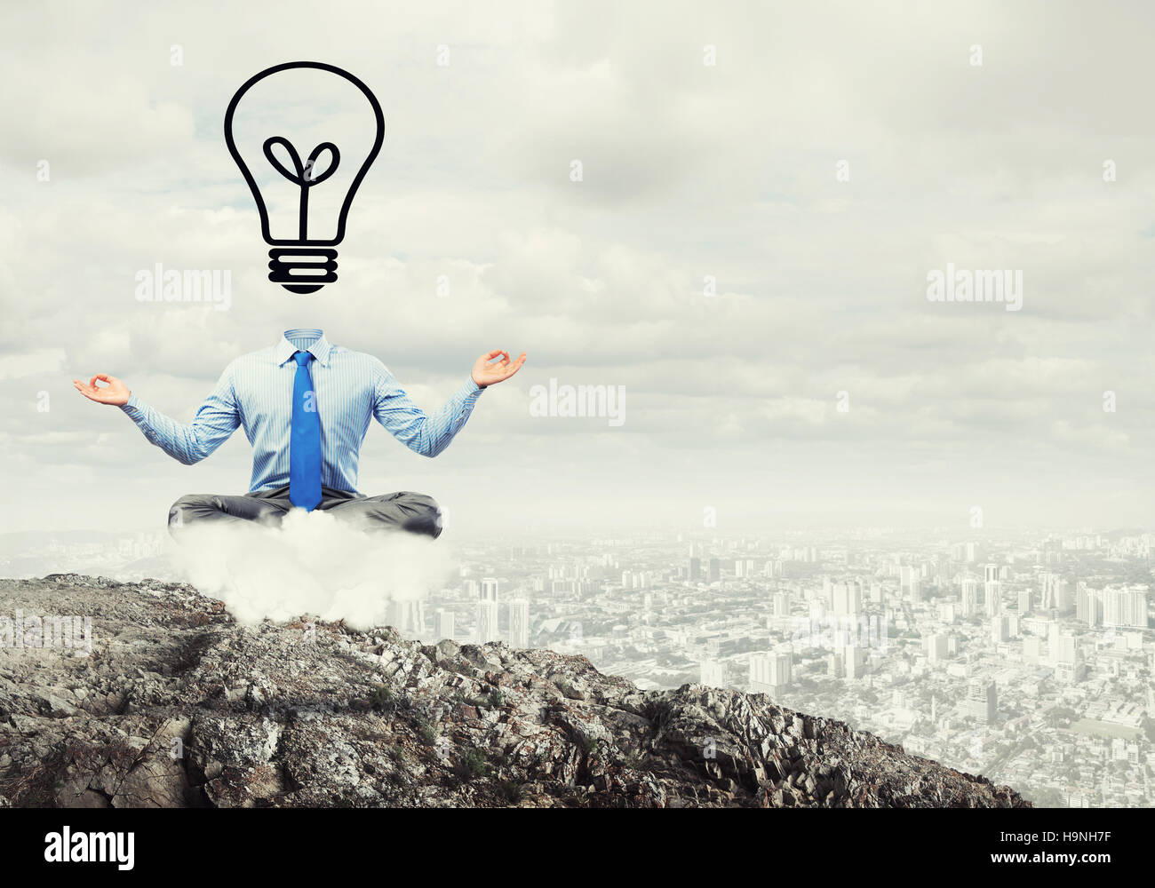 Headless businessman meditating Stock Photo - Alamy