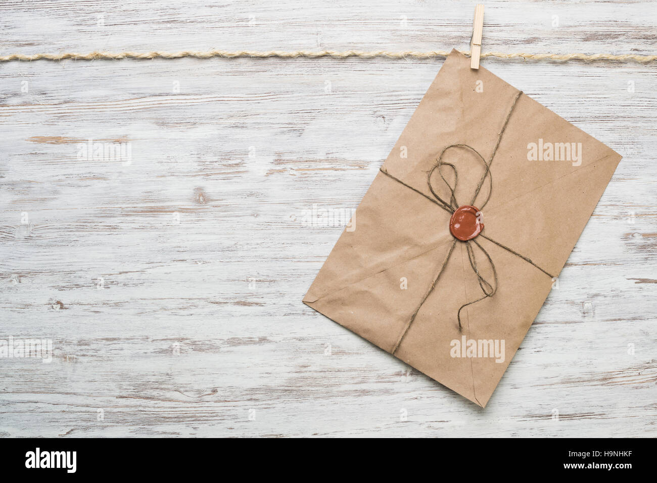 Mail envelope on rope Stock Photo - Alamy