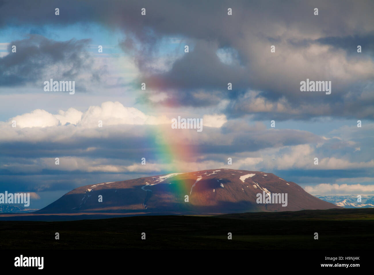 Rainbow with a mountain in Iceland Stock Photo - Alamy