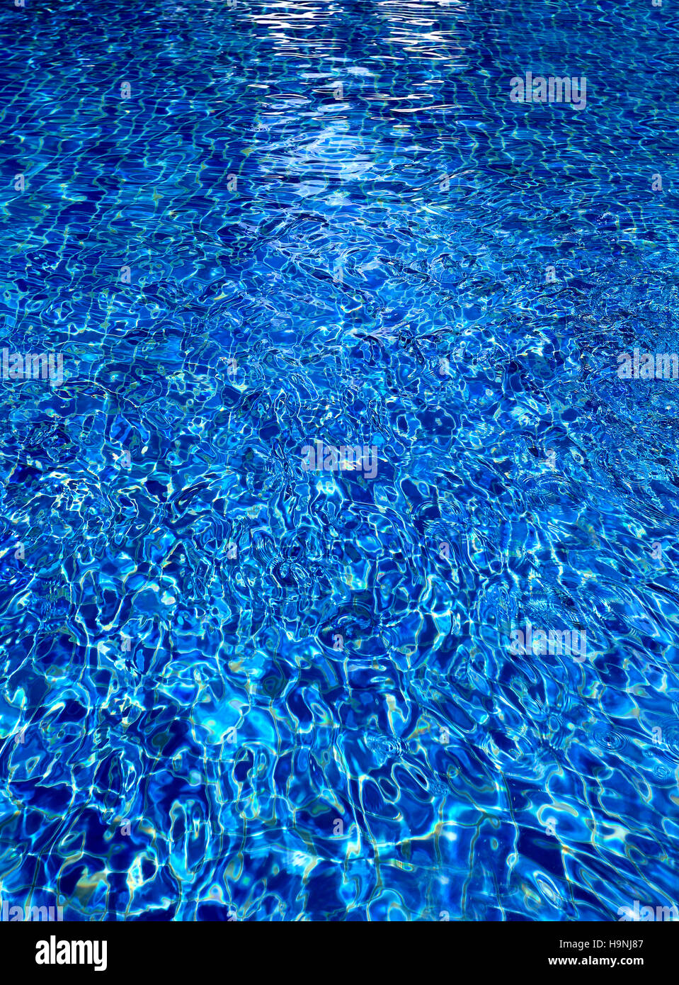 Bright photo of blue transparent pool water Stock Photo - Alamy