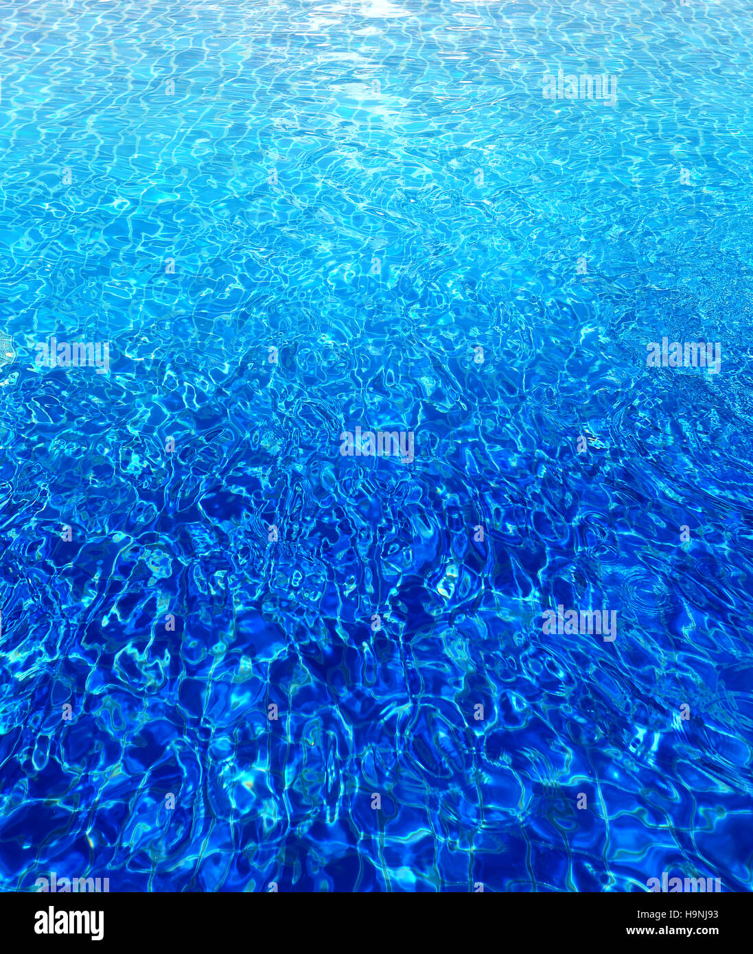 Bright photo of blue transparent pool water Stock Photo - Alamy
