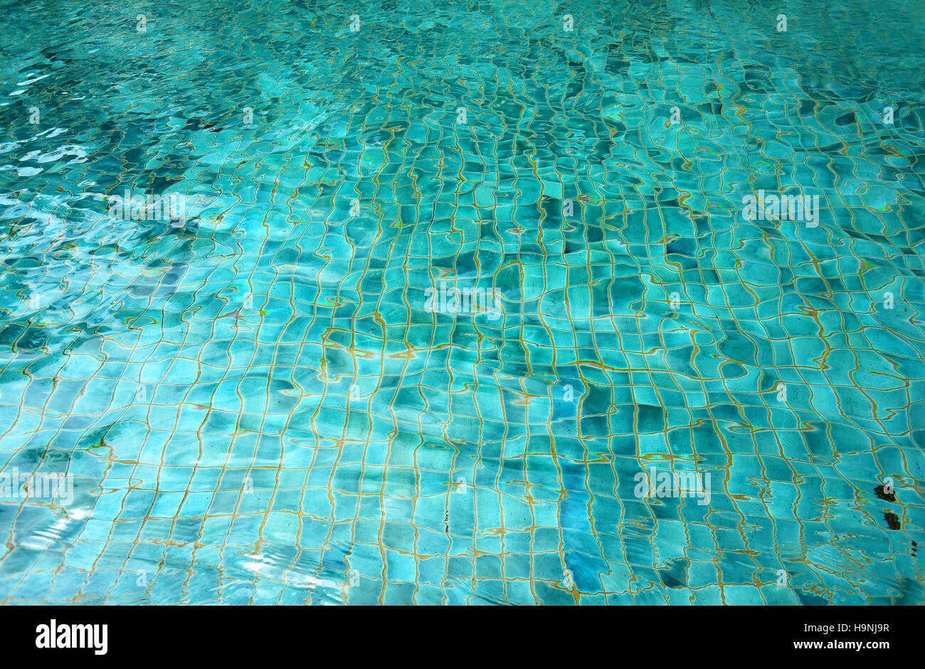Bright photo of blue transparent pool water Stock Photo - Alamy