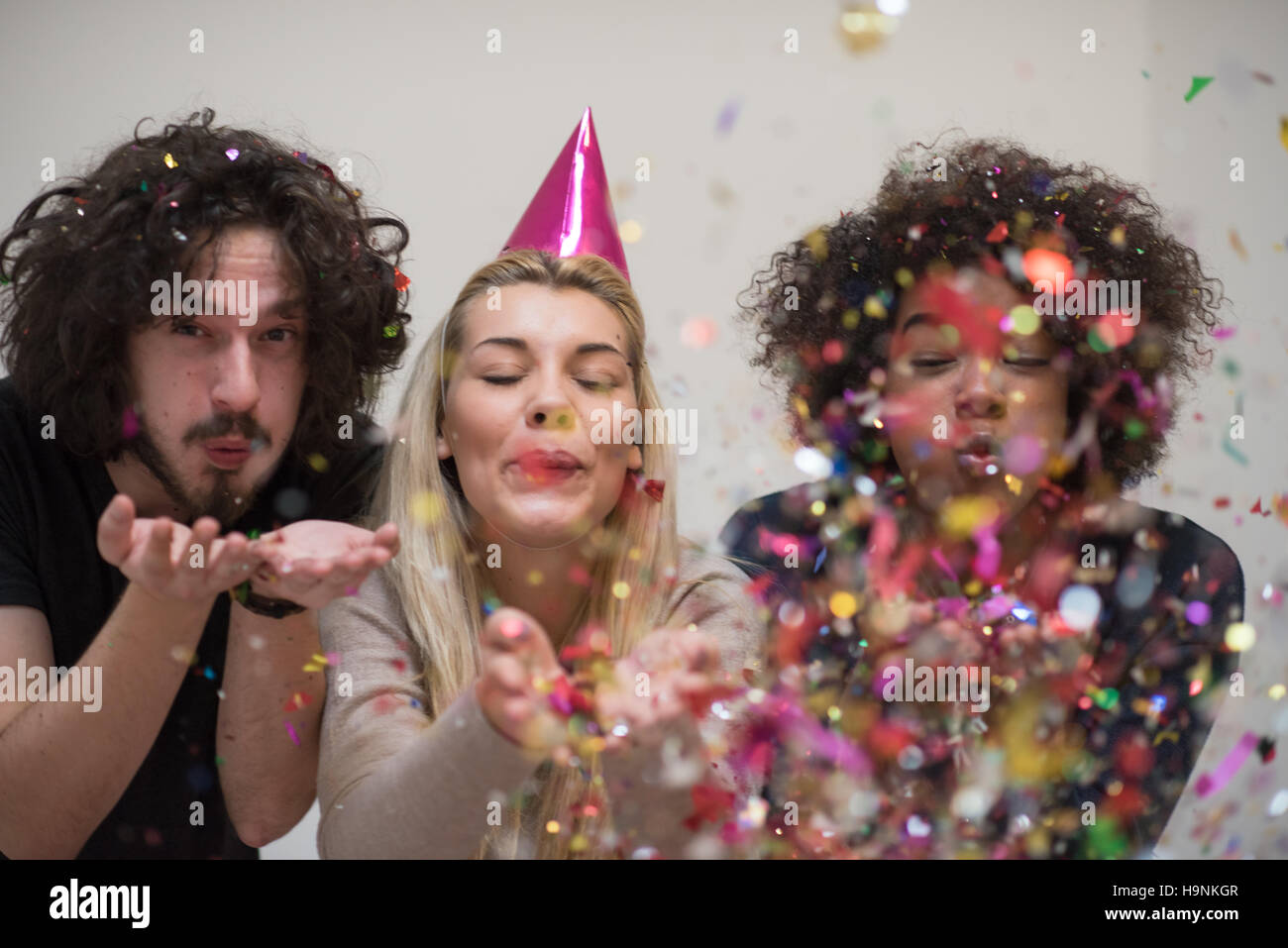 confetti party happy young people group celebrating new year eve while ...