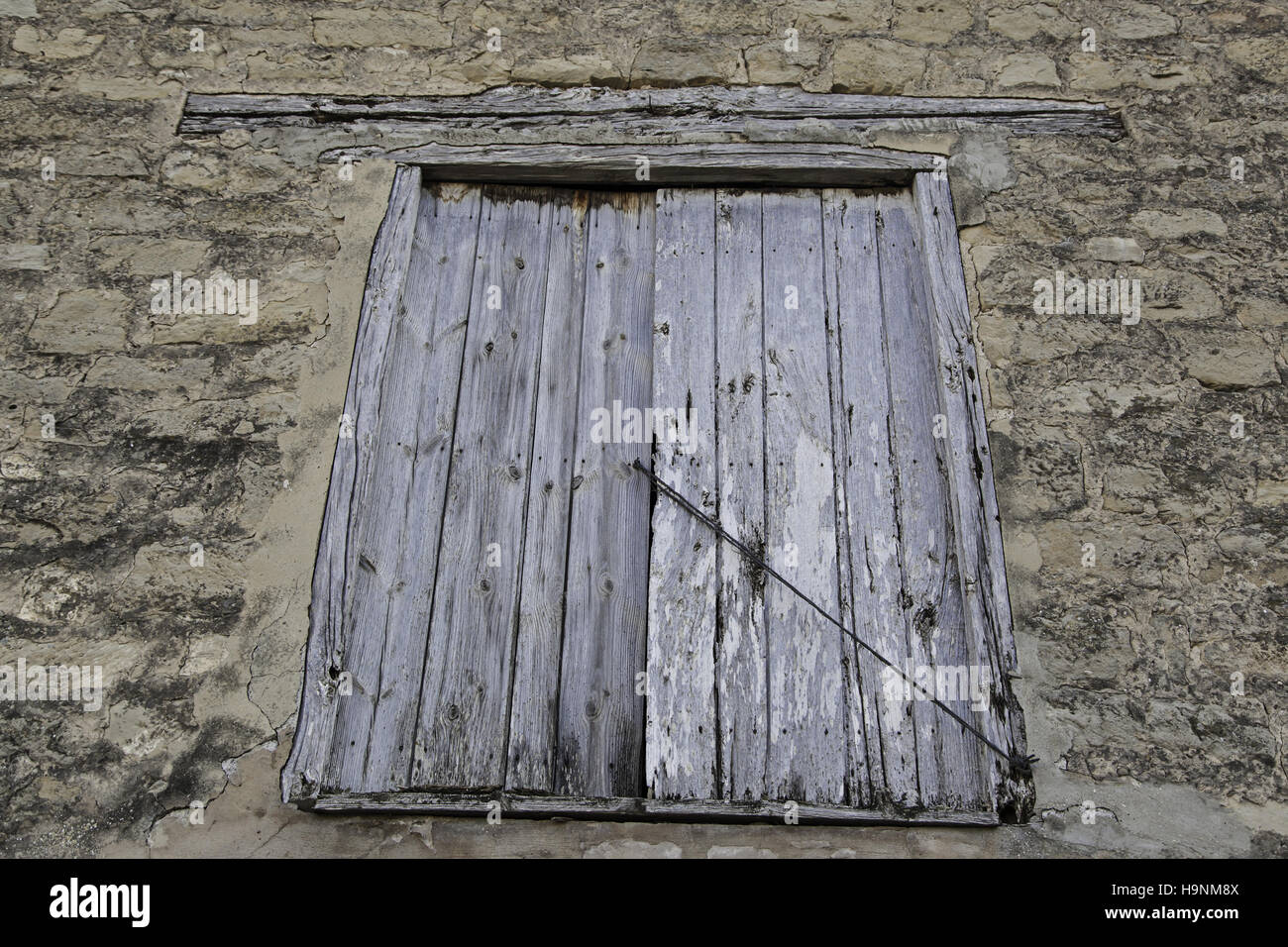 Scraped wooden door in urban building, construction Stock Photo - Alamy