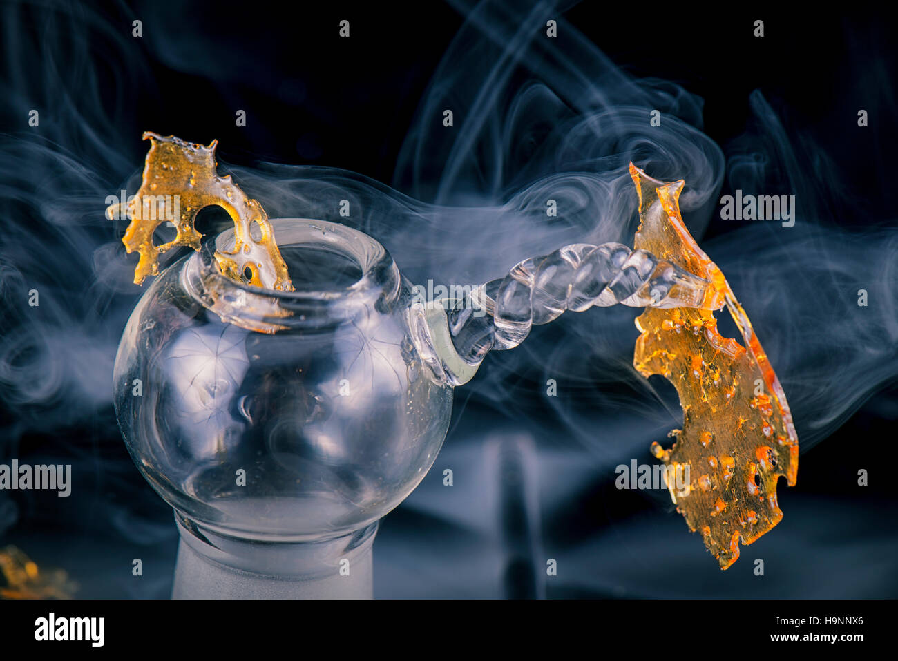 Close up detail of marijuana oil concentrate aka shatter isolated on ...