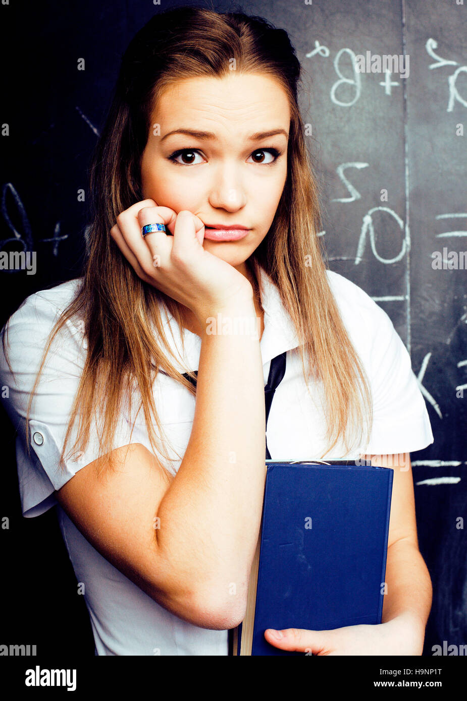 portrait of happy cute student with book in classroom Stock Photo - Alamy