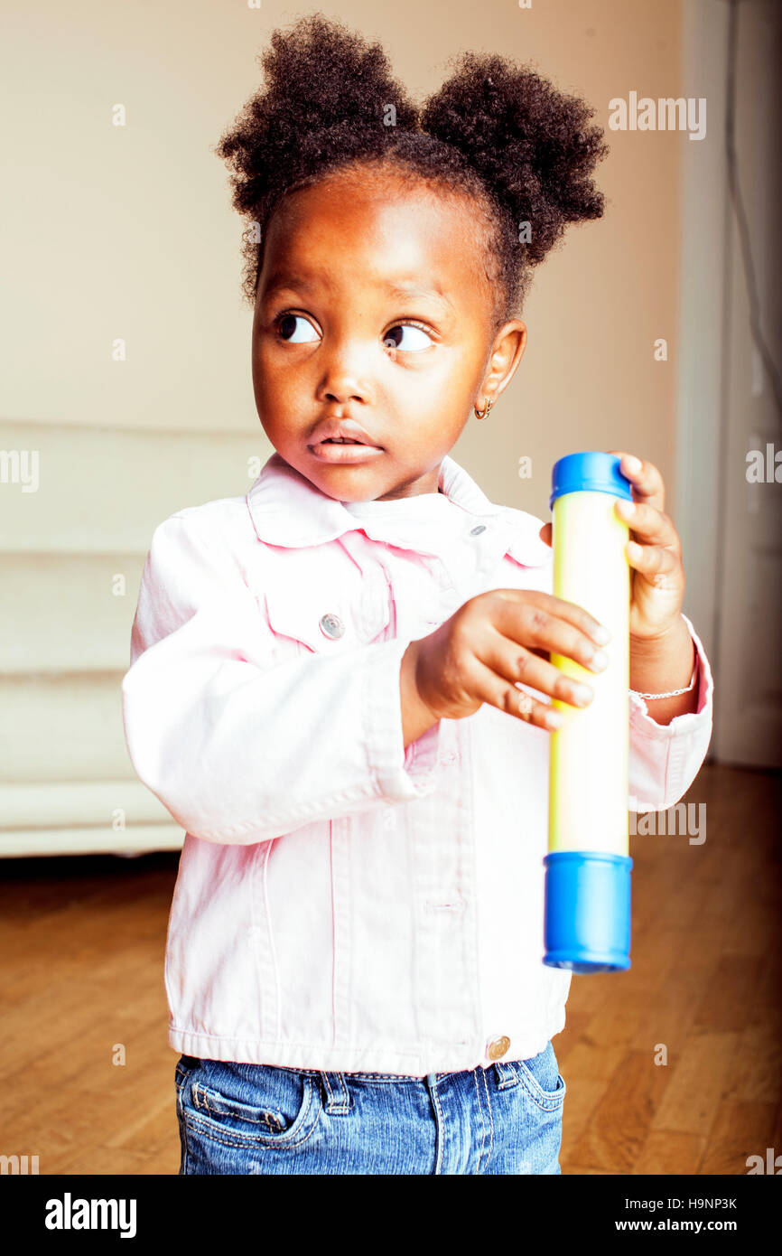 little cute african american girl playing with animal toys at ho Stock ... little cute african american girl playing with animal toys at ho Stock ...