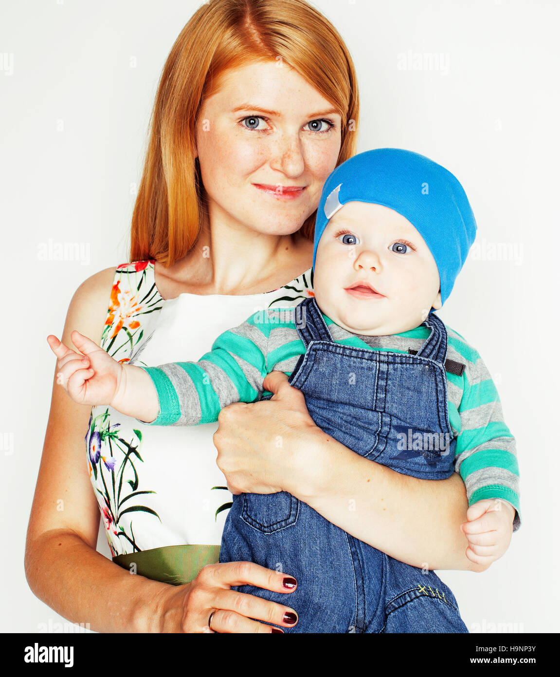young beauty mother with cute baby, red head happy modern family Stock ...
