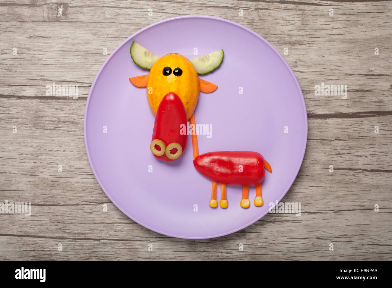 Elk made of vegetables on plate and board Stock Photo - Alamy
