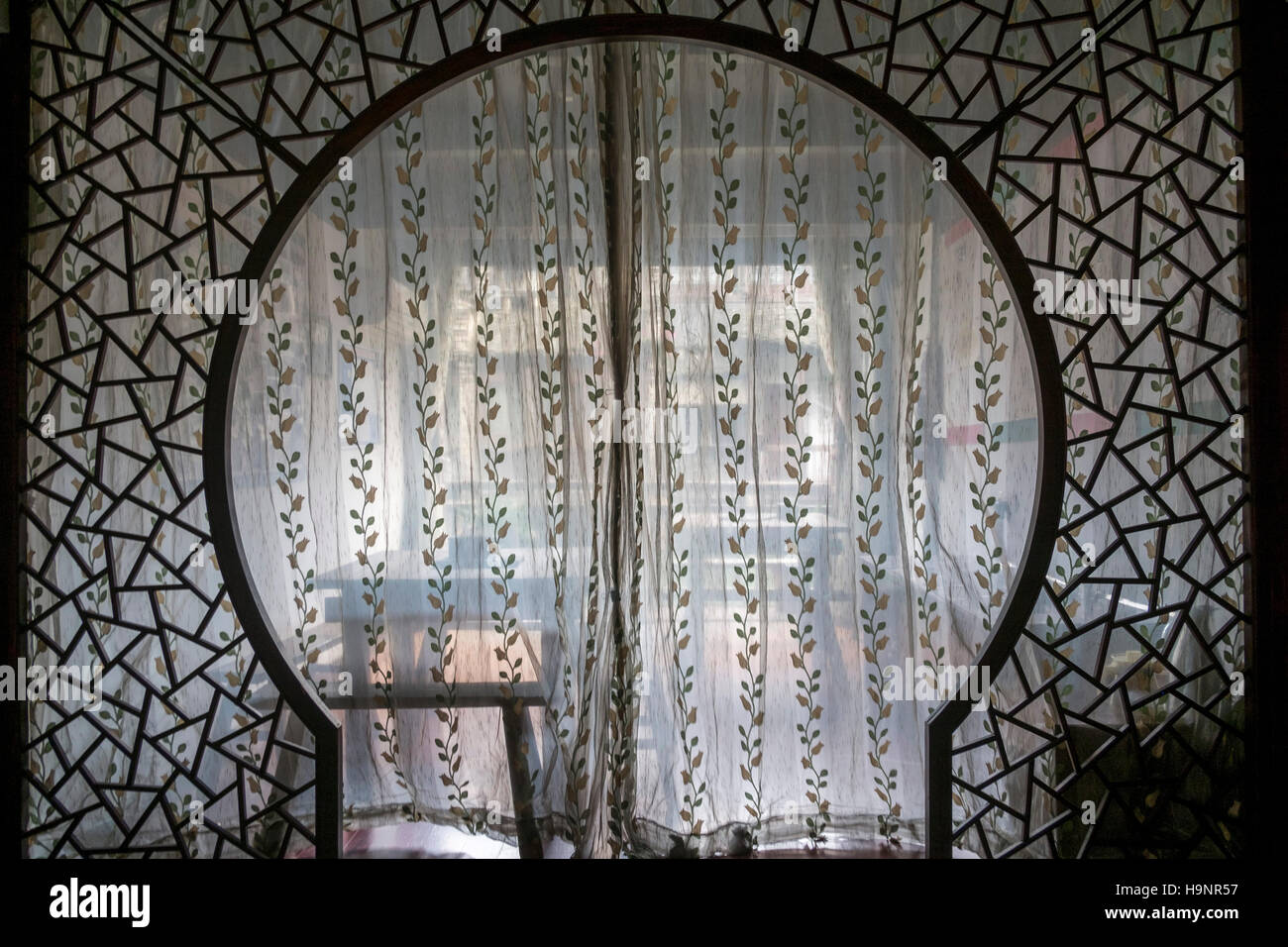 Round entrance to restaurant sitting area wuzhen china Stock Photo - Alamy