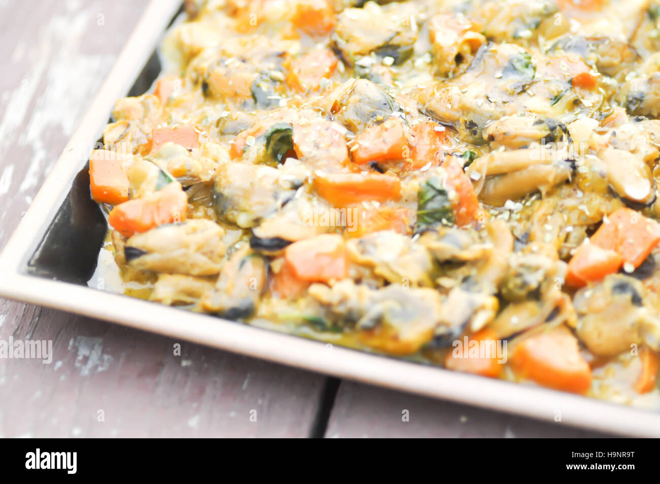 stir-Fried shell with carrot dish Stock Photo - Alamy