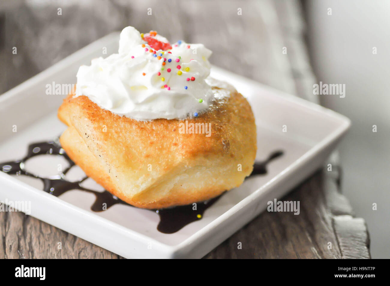 Fried ice cream and whipped cream topping dish Stock Photo - Alamy