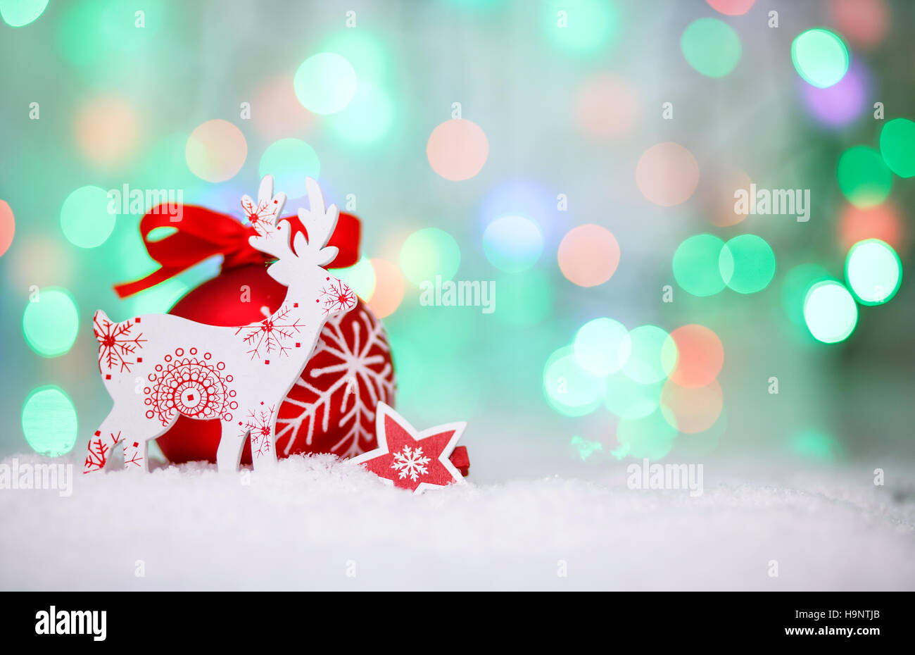decorative deer and red ball on Defocused Christmas light Bokeh Stock ...