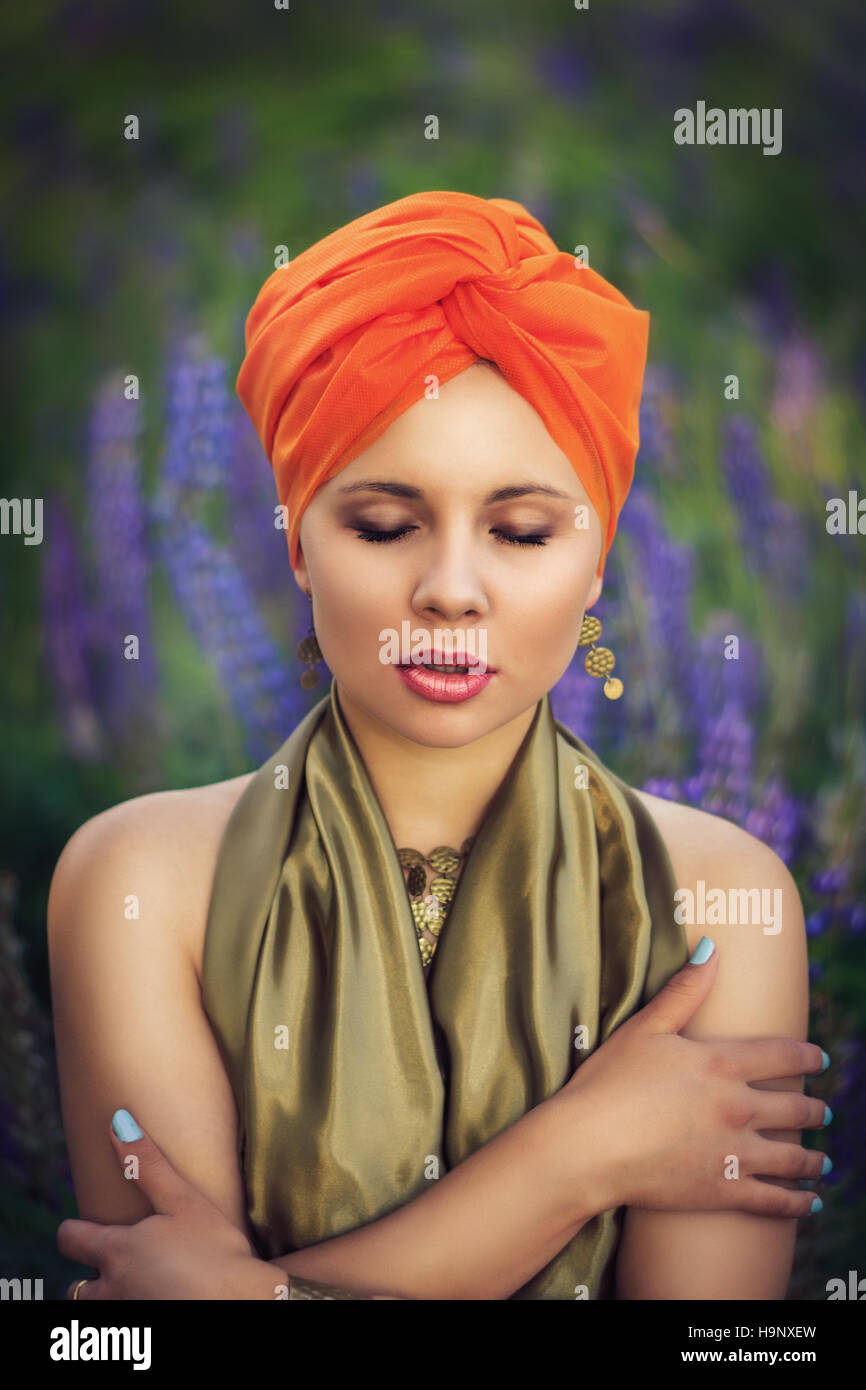 Woman in orange turban hi-res stock photography and images - Alamy