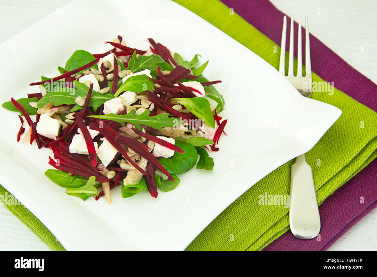 Salad of raw beets, pears, arugula, roots, sunflower seeds and c Stock ...