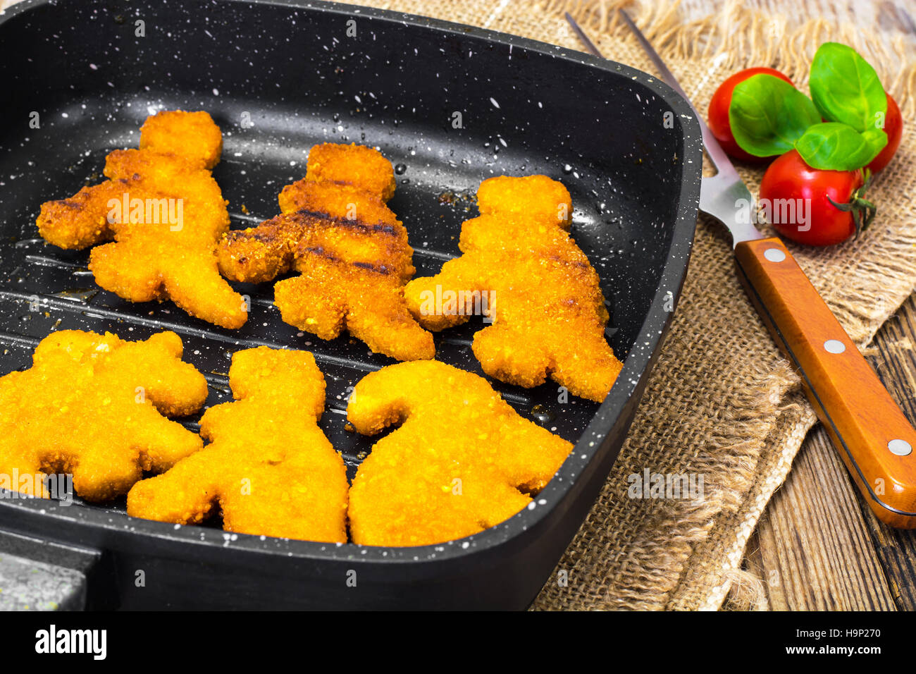 Fish nuggets for kids Dinosaurs Stock Photo - Alamy